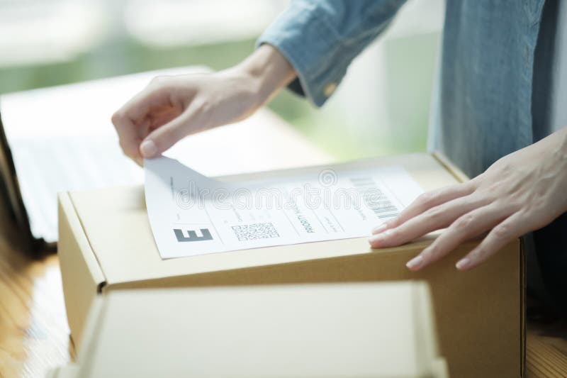 Attaching Shipping Label To a Parcel Stock Photo - Image of ...