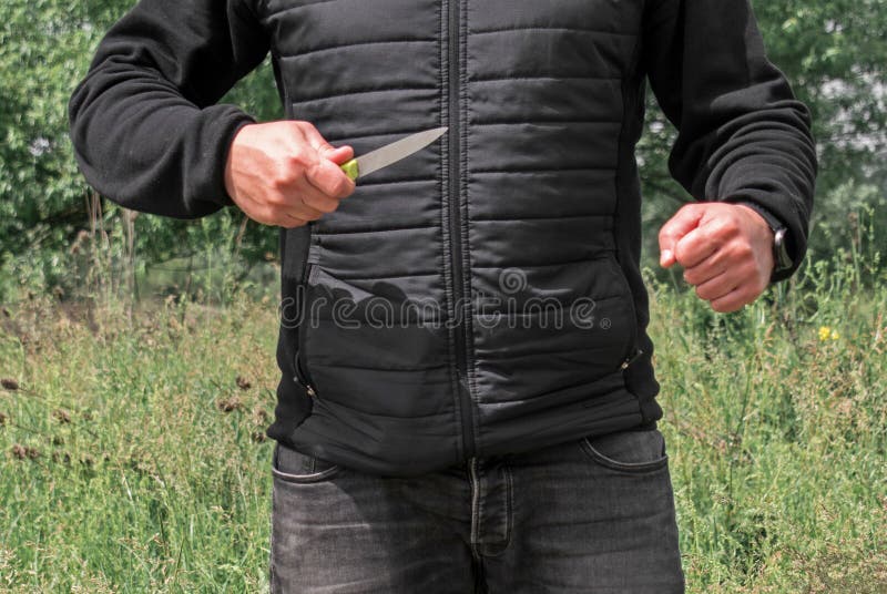 Attacker with Knife in Hand. Criminal Attack - Concept Stock Image ...