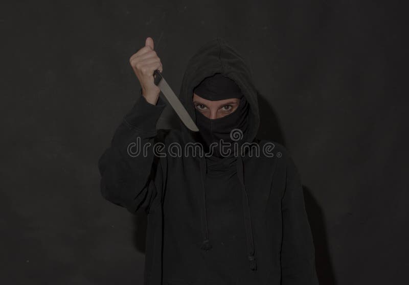 An attacker with a knife stock photo. Image of merciless - 197571880