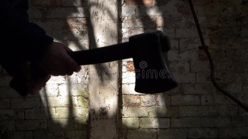 Attacker Prepares for Assault with Axe in Shadows Stock Video - Video ...