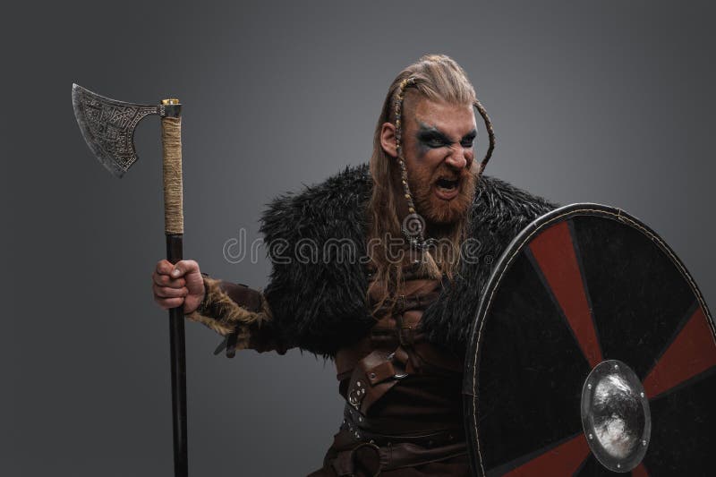 Attacking Viking Barbarian with Rounded Shield and Axe Stock Photo ...