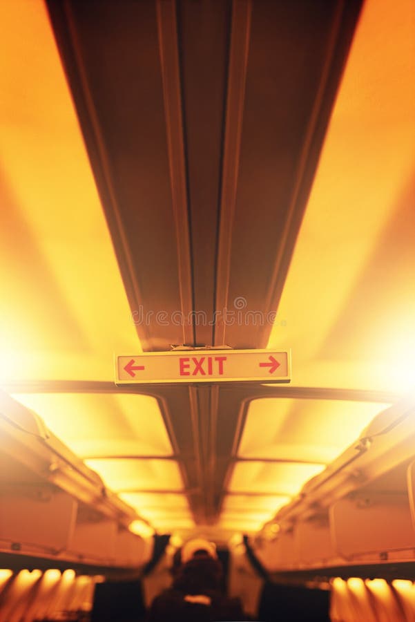Attention Passengers Please Take Note of the Emergency Exits. Shot of ...