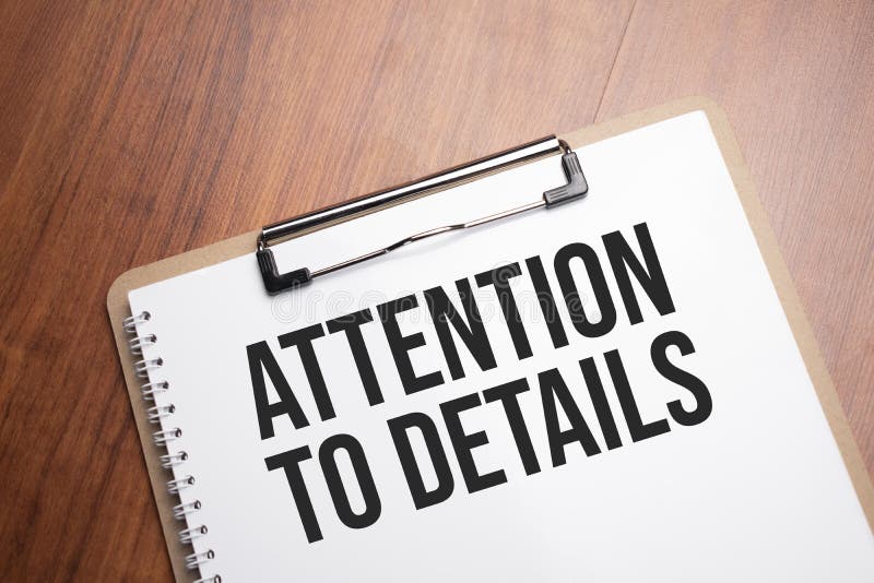 ATTENTION TO DETAILS Text on White Paper on the Wood Table Stock Image ...
