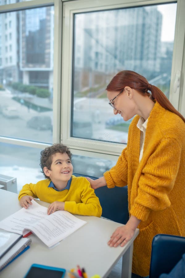 Smiling Teacher Appreciating Pupils Efforts during the Class Stock ...