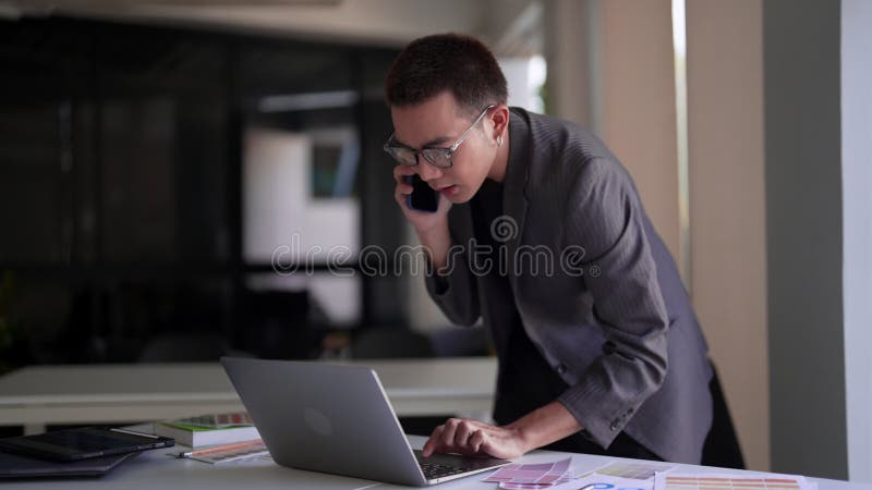 Attentive Asian Interior Designer Having a Focused Conversation on the ...