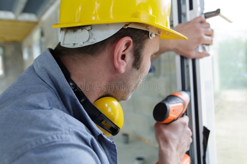 Attentive Builder Drilling Hole in Wall Stock Photo - Image of ...