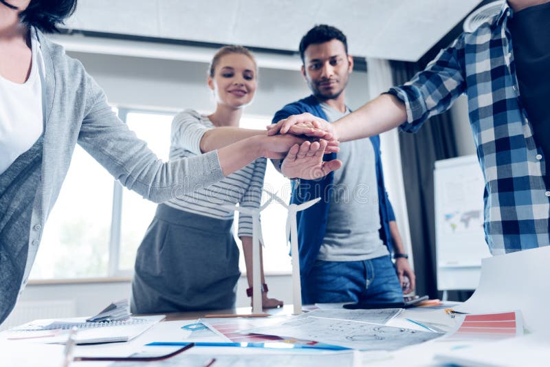 Attentive Colleagues Holding Hands Over Table Stock Image - Image of ...