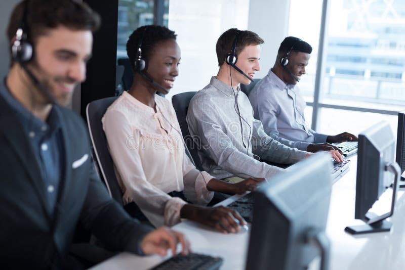Customer Service Executives Working at Office Stock Photo - Image of ...