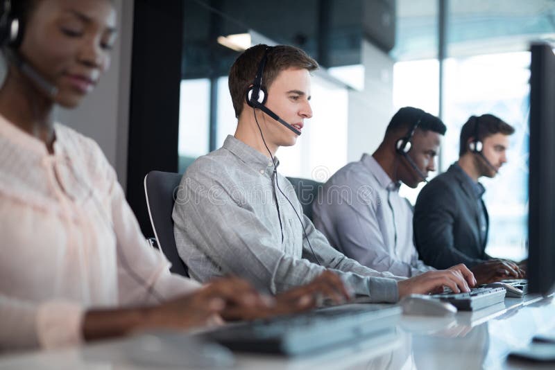 Customer Service Executives Working at Office Stock Photo - Image of ...