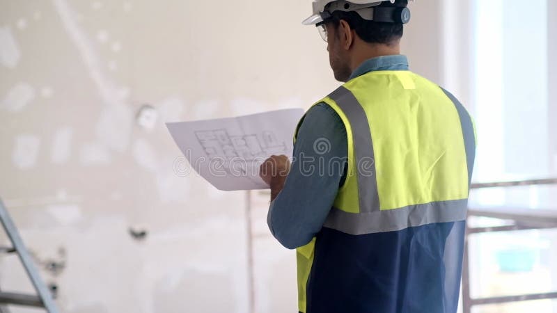 Curious Engineer Holding Apartment Drawing in Hands Looks at Shabby ...
