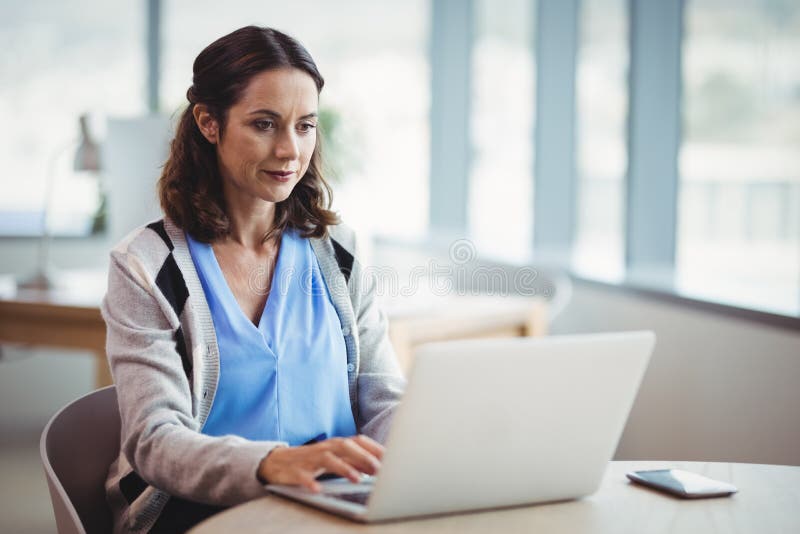 Attentive Executive Using Laptop at Desk Stock Photo - Image of ...