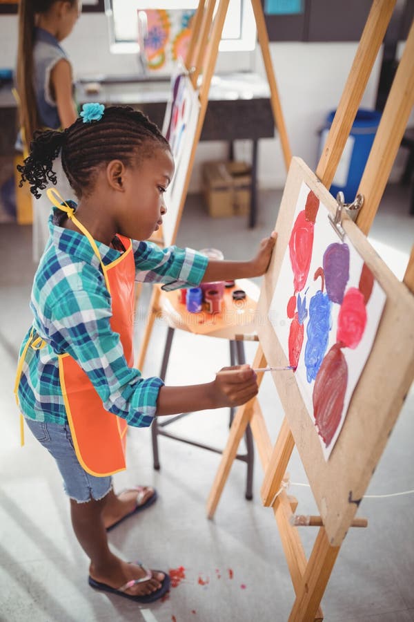 Attentive Girl Panting on Canvas Stock Photo - Image of easel, canvas ...
