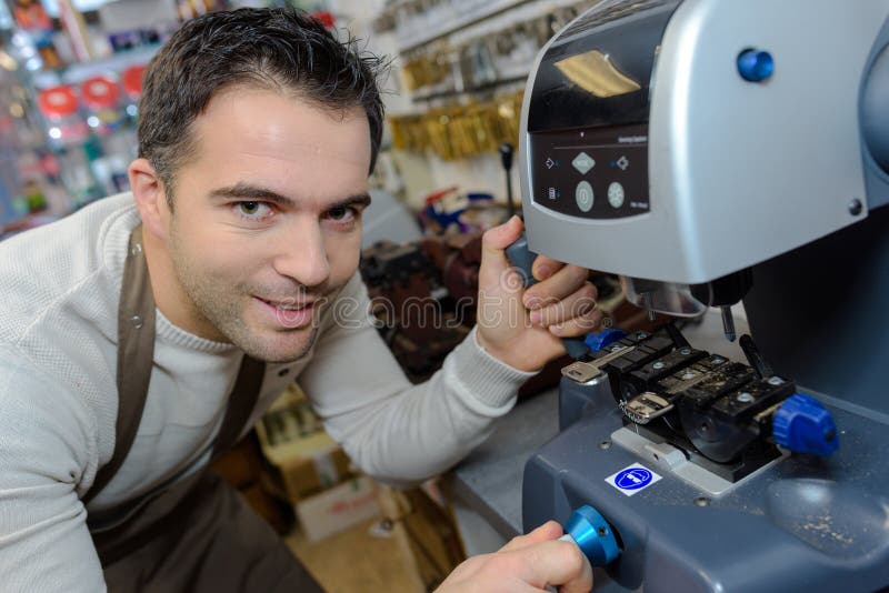 Attentive Professional Making Key in Locksmith Stock Photo - Image of ...
