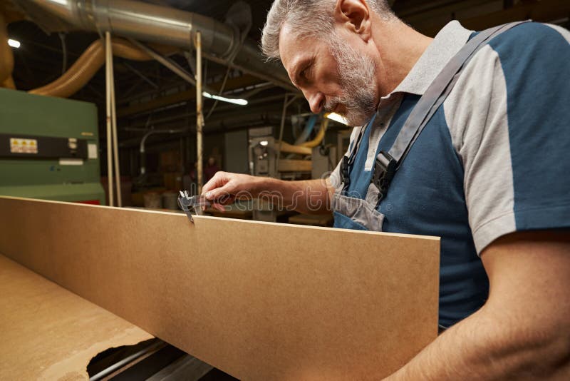 Focused Photo on Serious Master Working in Shop Stock Image - Image of ...