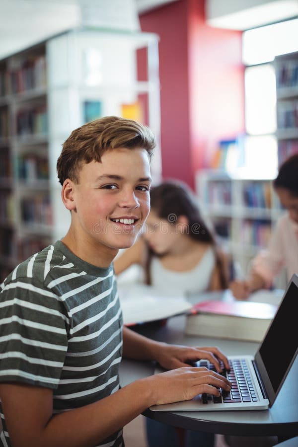 Attentive Student Using Laptop in Library Stock Photo - Image of learn ...
