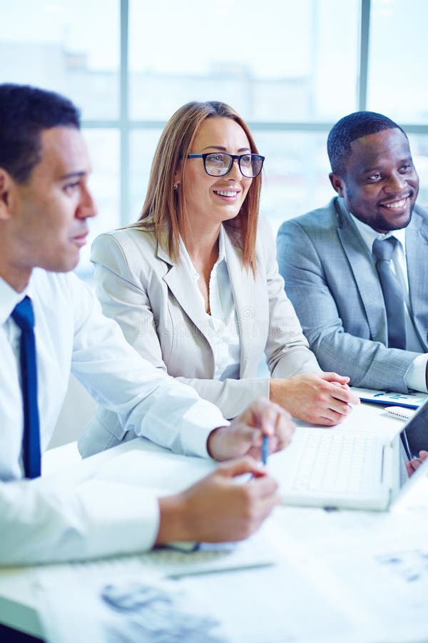 Attentive co-workers stock photo. Image of blueprint - 17451292