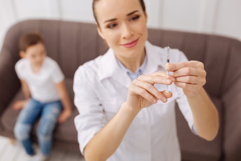 Attentive Young Physician Getting the Injection Ready Stock Photo ...