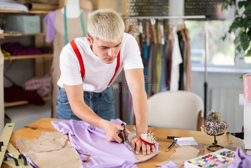 Attentive Young Tailor Cutting Textile in Sewing Studio Stock Photo ...