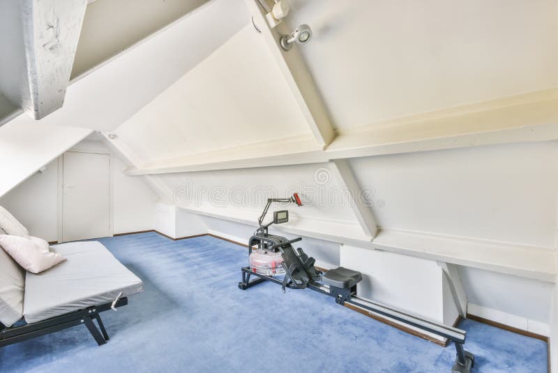 Attic with a Simulator and a Low Sofa Stock Photo - Image of luxury ...