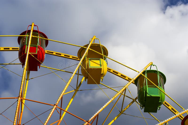 Attraction Carousel Ferris Wheel on the Background of the Cloudy Sky ...