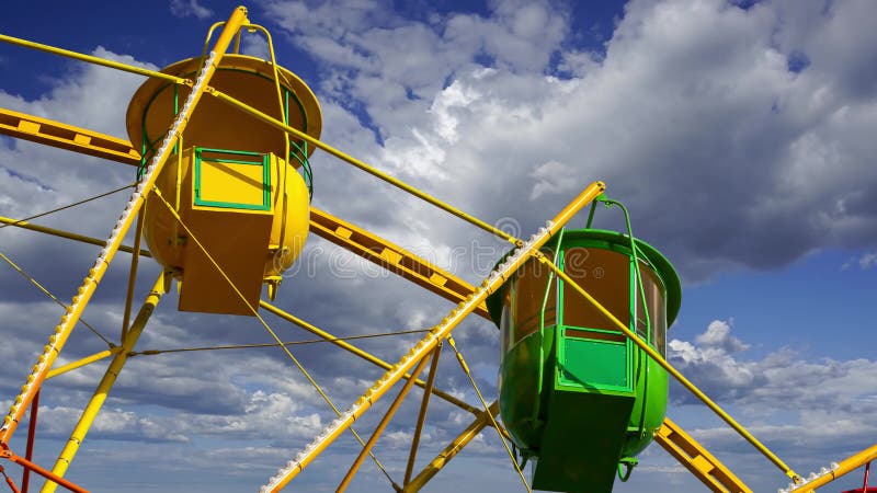 Attraction Carousel Ferris Wheel on the Background of the Cloudy Sky ...