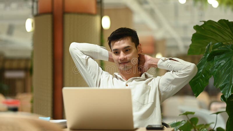 Attractive Asian Businessman Taking a Break from Computer Work Relaxing ...