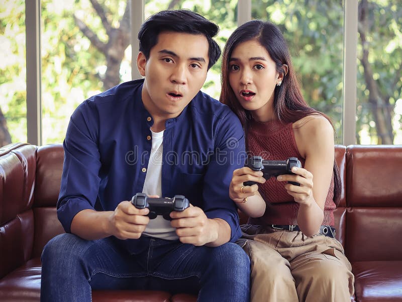 Asian Couple Spend Good Time At Home A Man Sitting On The Floor With