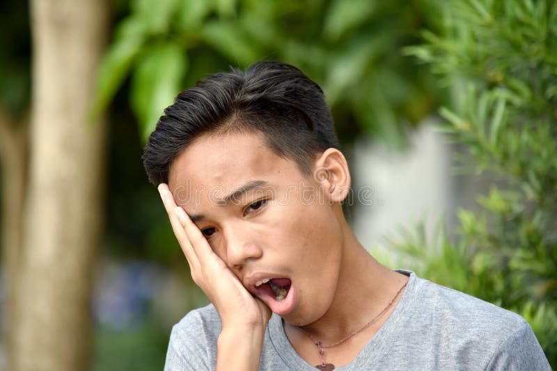 Yawning Youthful Filipino Teenager Boy Stock Image - Image of yawning ...