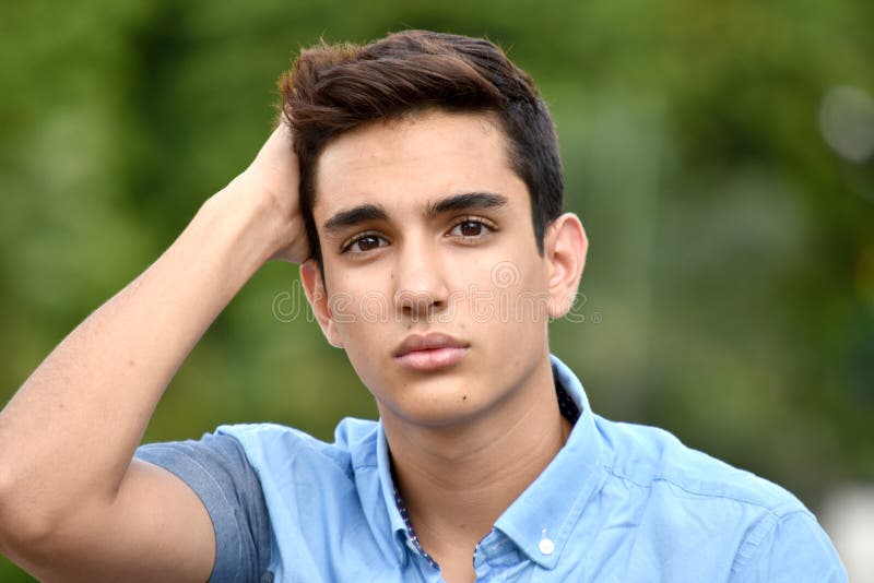 A Forgetful Hispanic Boy stock photo. Image of young - 261288470