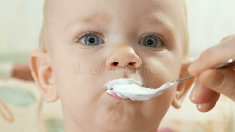 Attractive Baby Eats Cottage Cheese with Spoon Using Mothers. Kid 1 ...
