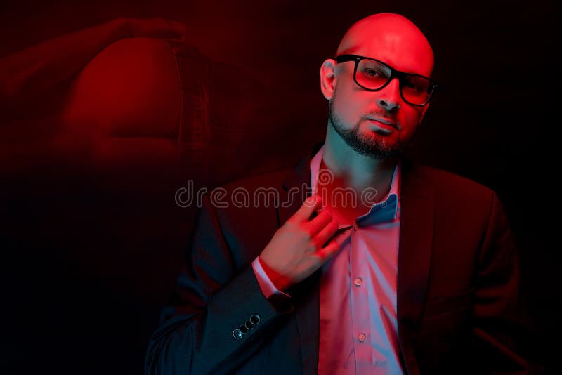 Attractive Bald Man with Beard with Glasses on Neon Light Background ...