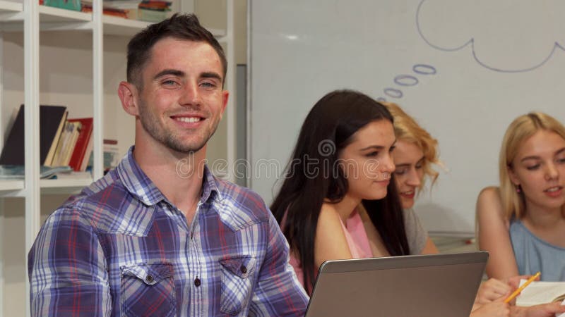 Cheerful Young Man Smiling Joyfully while Working on His Laptop Stock ...