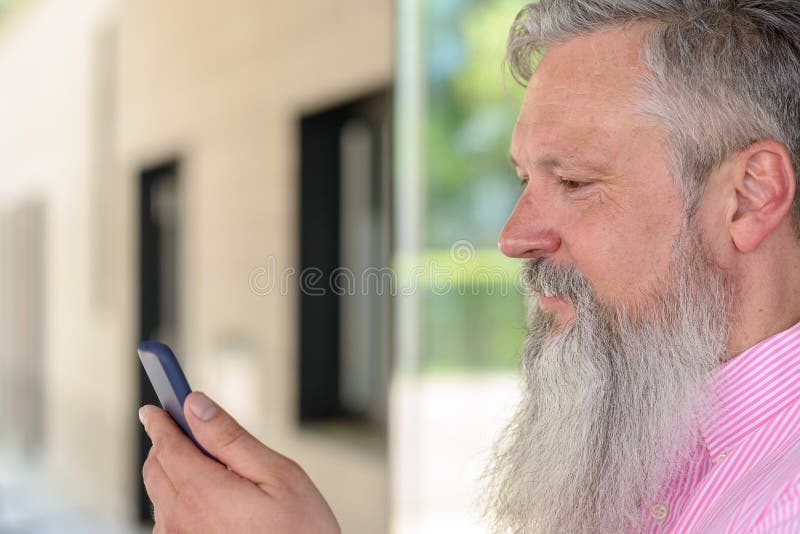Attractive Bearded Man Reading a Text Message Stock Image - Image of ...