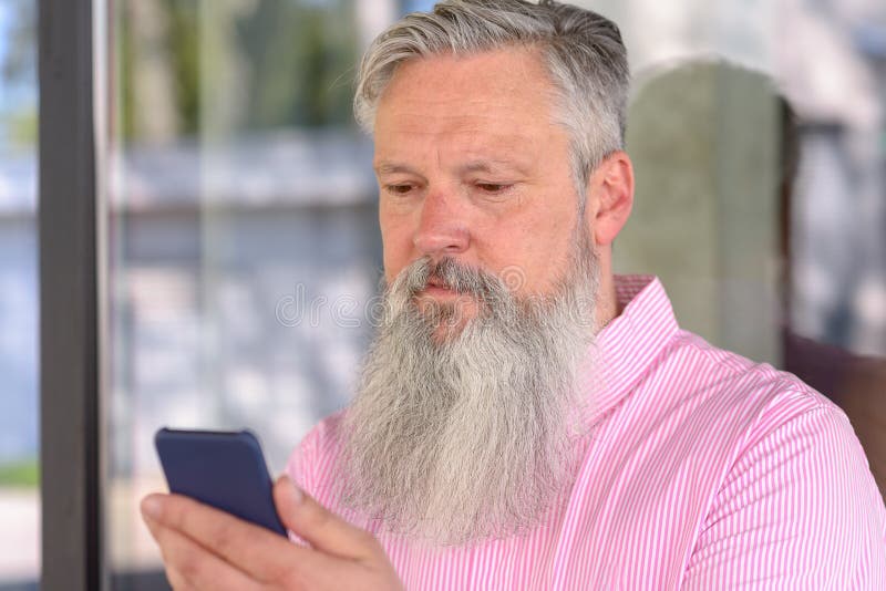 Attractive Bearded Man Reading a Text Message Stock Photo - Image of ...