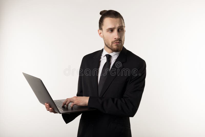 Attractive Bearded Middle Manager Wearing Black Suit and Tie Thinking ...