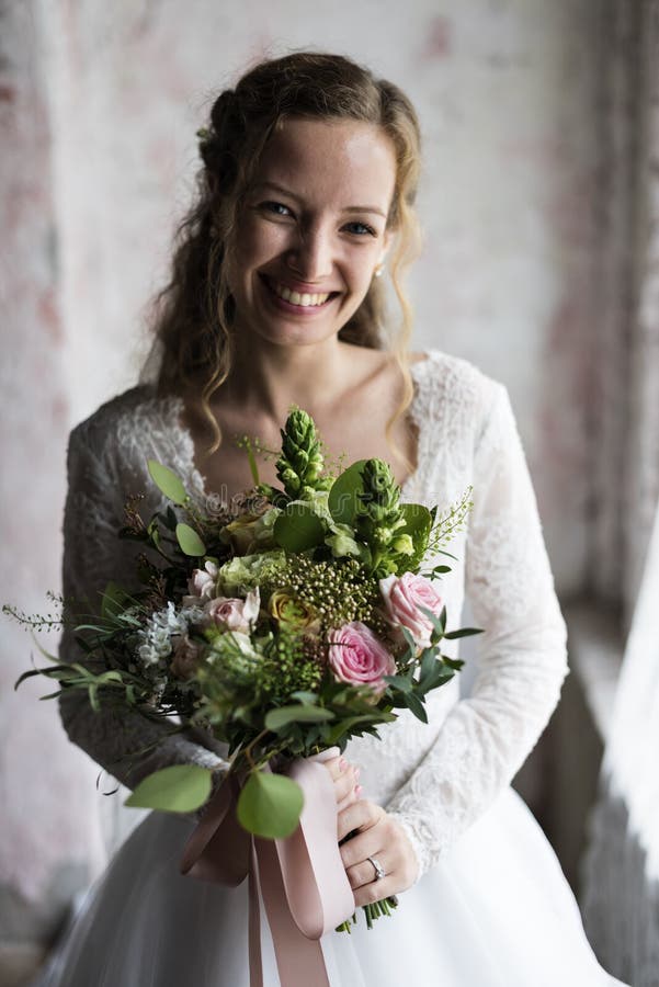 Attractive Beautiful Bride Holding Flowers Bouquet Stock Photo - Image ...