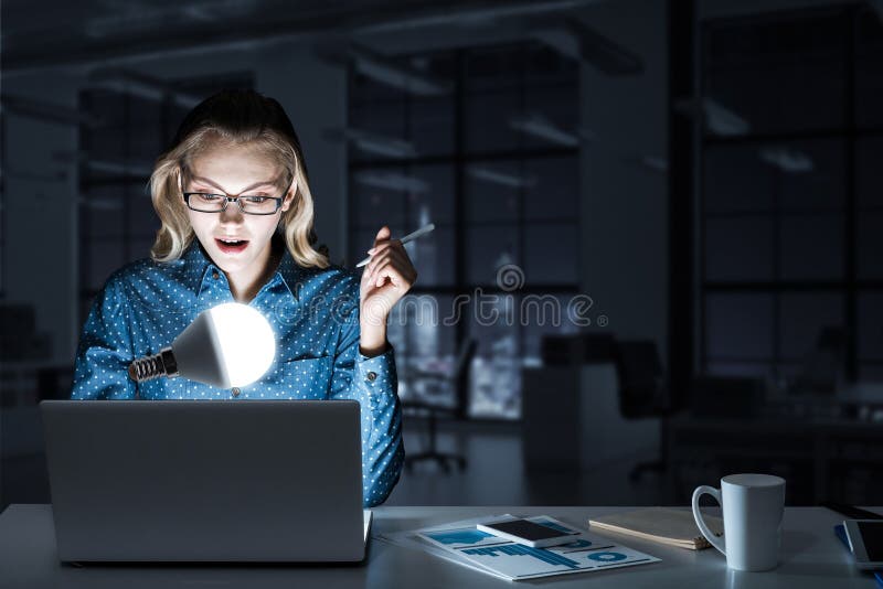 Attractive Blonde Wearing Glasses in Dark Office Using Laptop. M Stock ... Attractive Blonde Wearing Glasses in Dark Office Using Laptop. M Stock ...