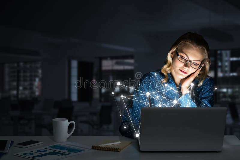 Attractive Blonde Wearing Glasses in Dark Office Using Laptop. M Stock ... Attractive Blonde Wearing Glasses in Dark Office Using Laptop. M Stock ...