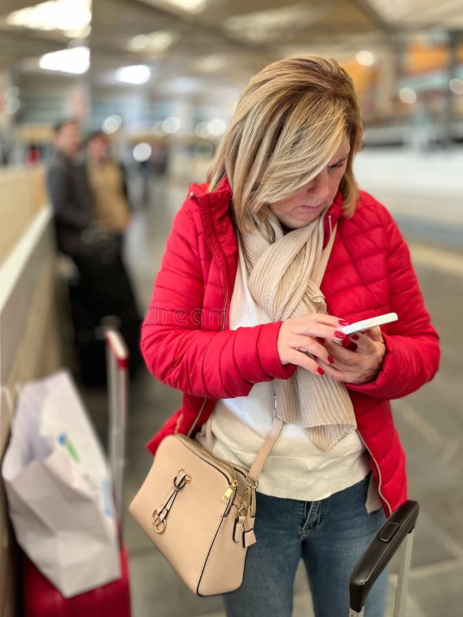Attractive Blonde Woman Waiting a the Train Station Using Mobile Phone ...