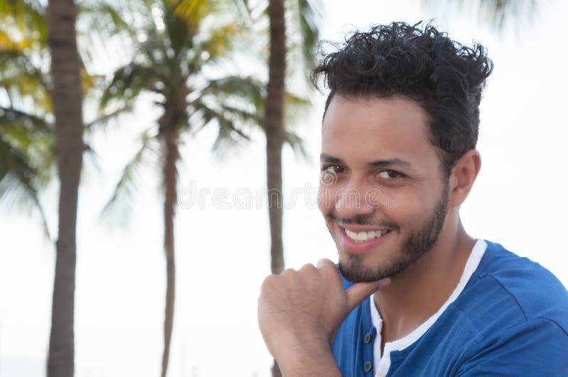 Attractive Guy with Brazilian Jersey and Hat Laughing at Camera Stock ...