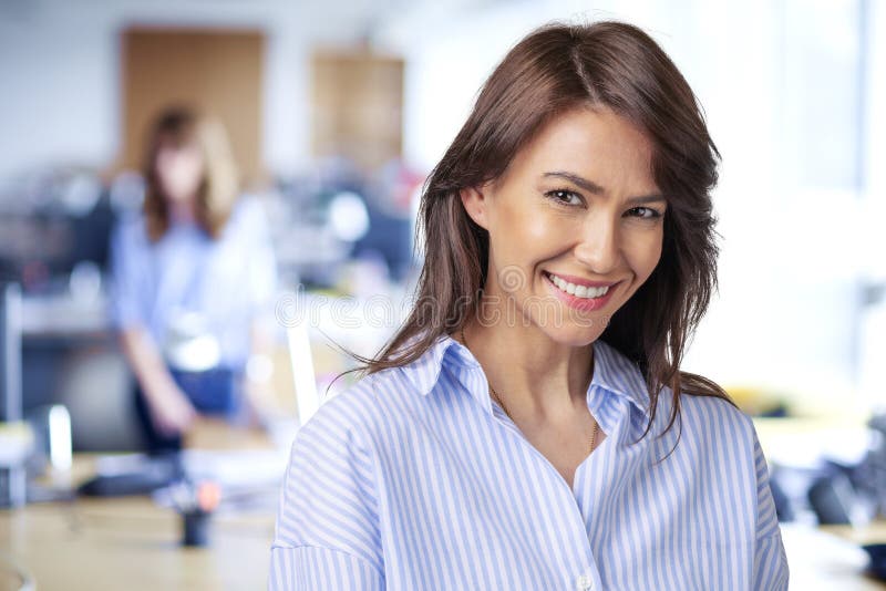Attractive Brunette Haired Business Woman Wearing Shirt And Toothy