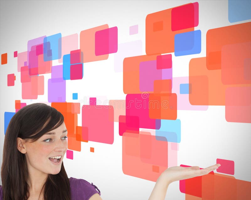 Attractive Brunette Holding Hand Out As a Presentation Stock Photo ...