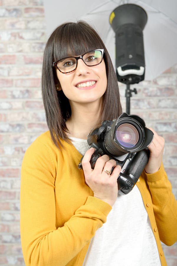 Attractive Brunette Woman with Photo Camera in Studio Stock Photo ...