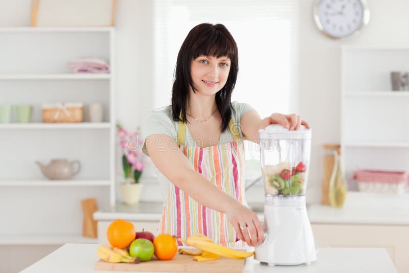 Attractive Brunette Woman Using a Blender Stock Image - Image of little ...