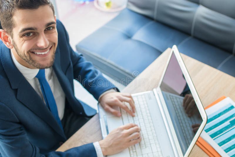 Business man with laptop stock photo. Image of company - 157219444