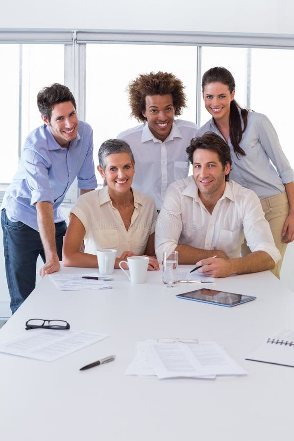Attractive Business People Smiling in the Workplace Stock Photo - Image ...