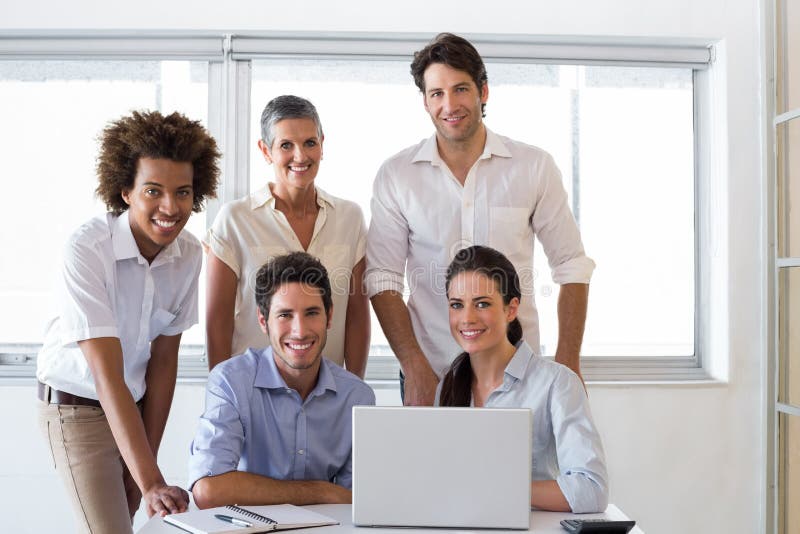 Attractive Business People Smiling in the Workplace Stock Photo - Image ...