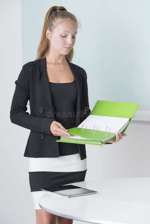 Attractive Businesswoman with Portfolio in Office Stock Image - Image ...