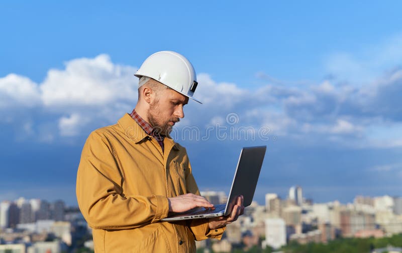 Inspector in Hardhat Using Laptop at Construction Site Stock Image ...