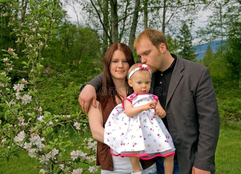 Attractive Caucasian Family Stock Photo - Image of kissing, nature: 9668944